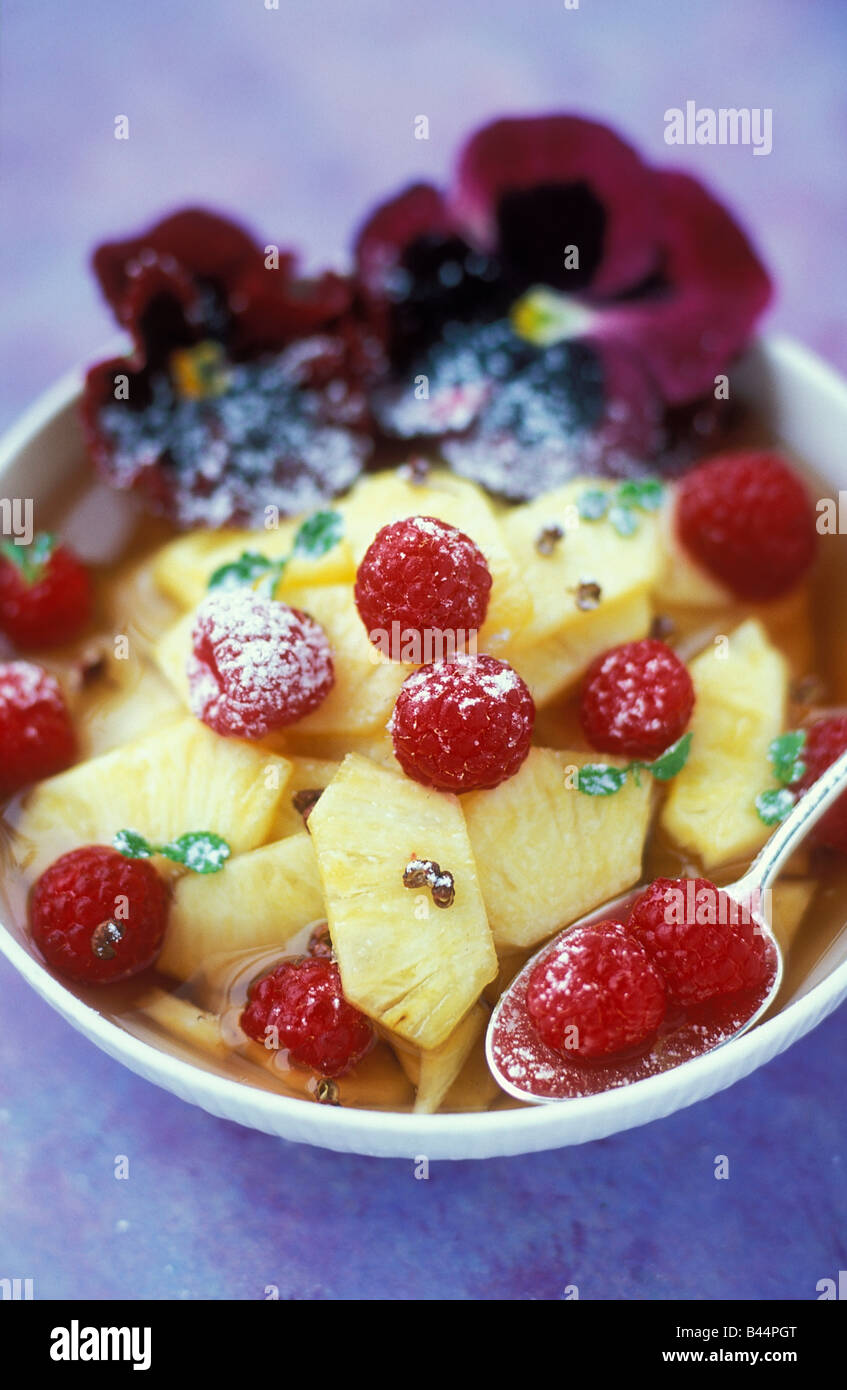 pineapple, raspberry and pansy salad Stock Photo - Alamy