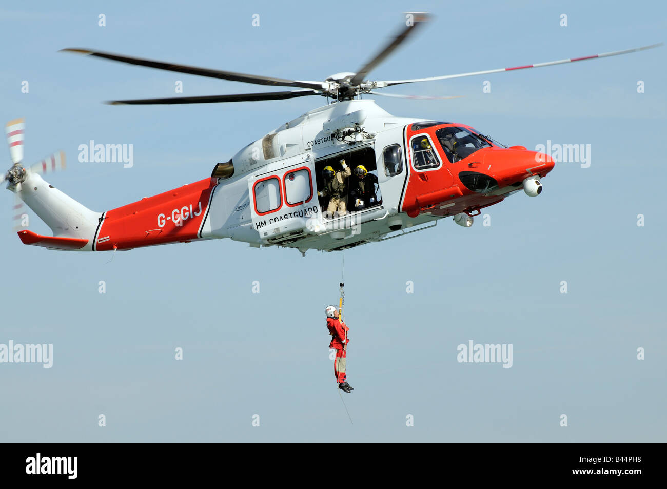 Coast Guard search and rescue helicopter on exercise winching a RNLI ...