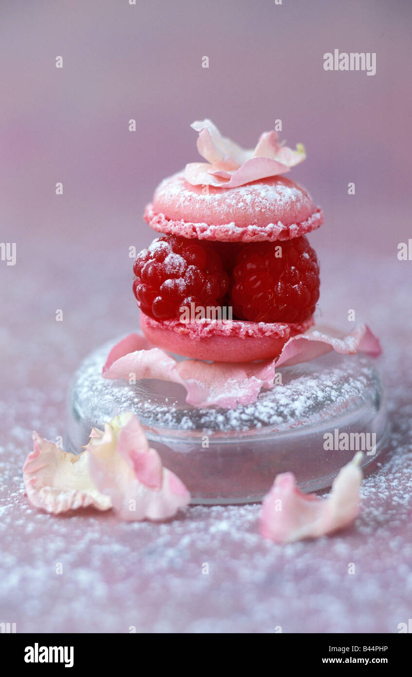 raspberry macaroon with rose petals Stock Photo - Alamy