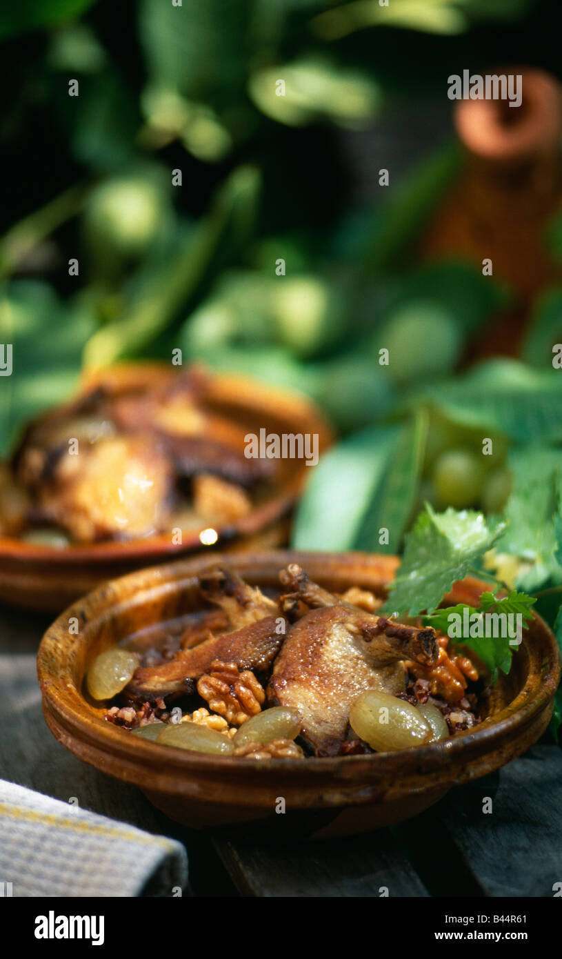 Pigeon and grape tajine Stock Photo - Alamy