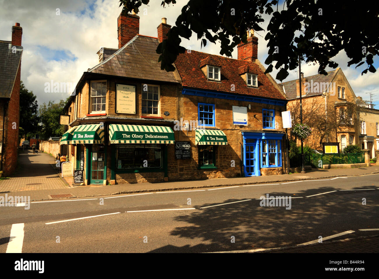 A view of a small shop on a main road Stock Photo - Alamy