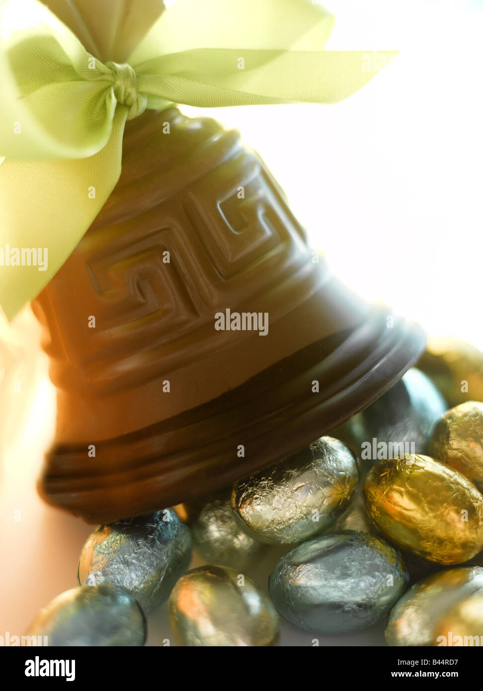 Chocolate Easter bell and small easter eggs Stock Photo - Alamy