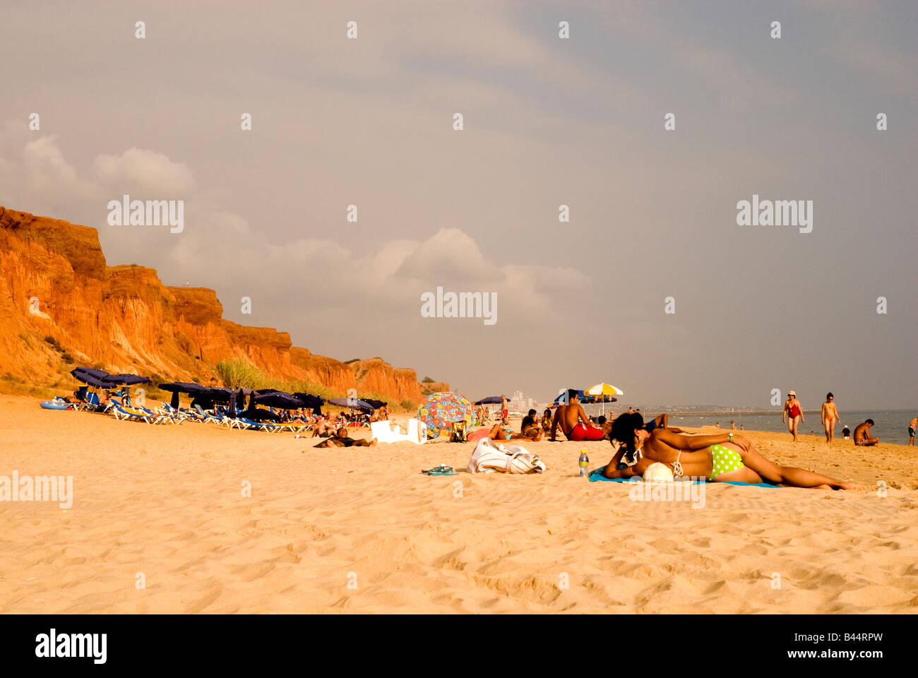 Woman sunbathing at the seaside hi-res stock photography and images - Alamy