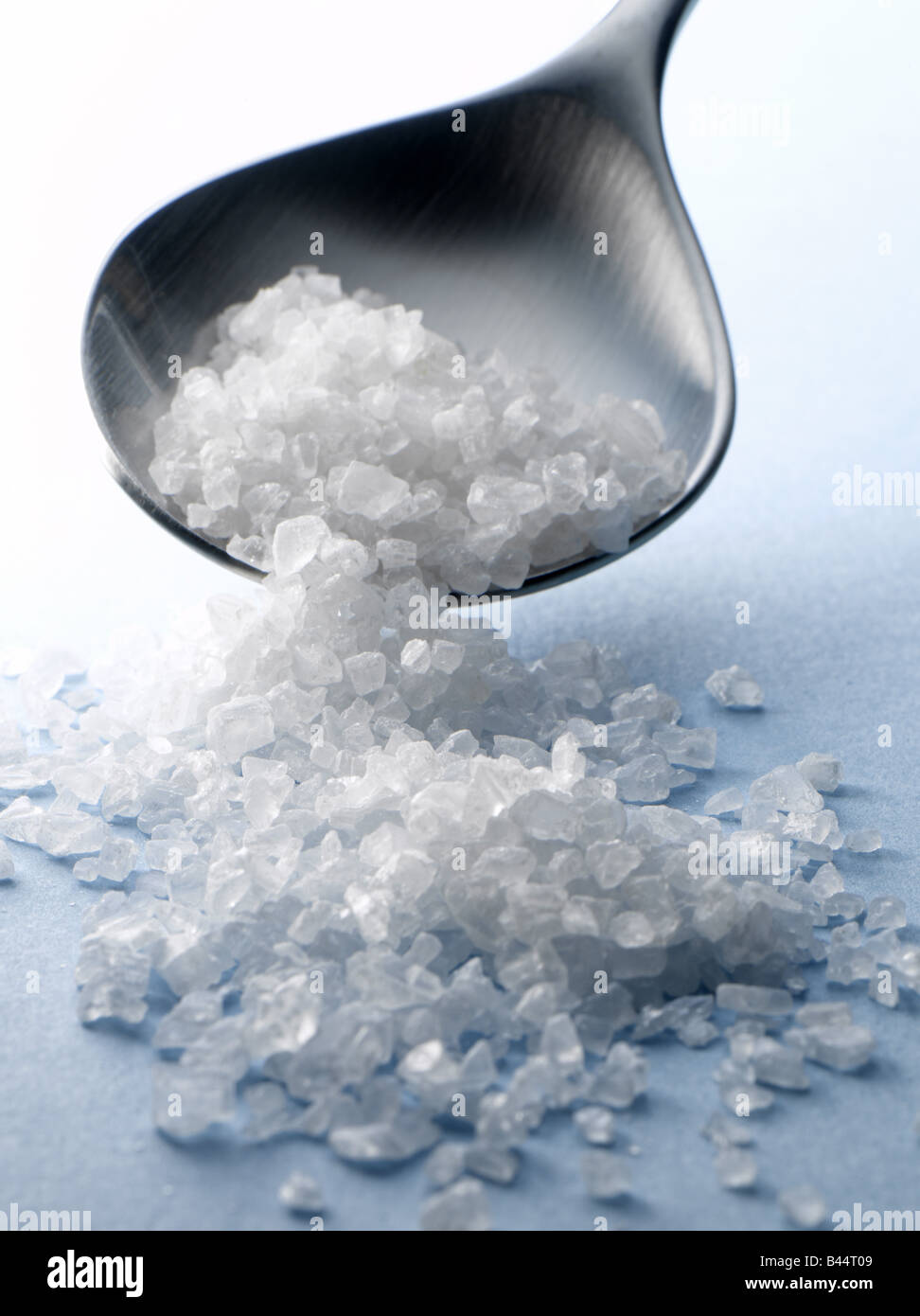 Spoonful of coarse salt Stock Photo - Alamy
