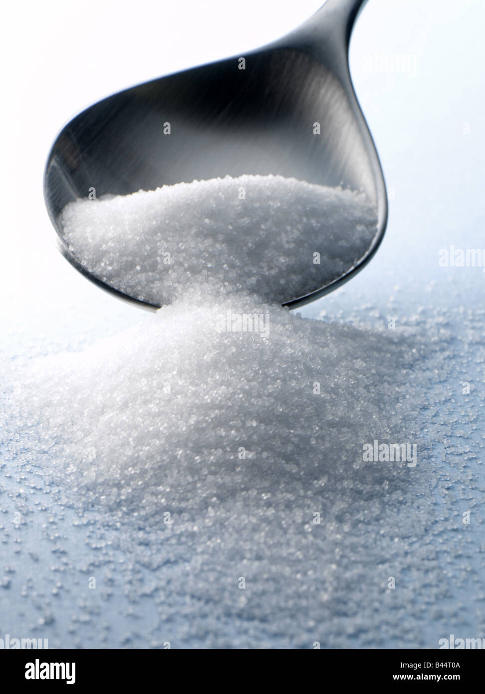Spoonful of fine salt Stock Photo - Alamy