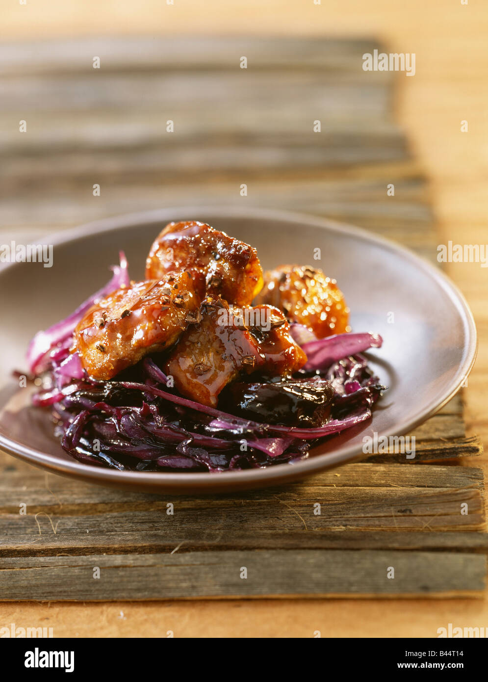 Caramelized duck with red cabbage and prunes and coffee sauce Stock ...