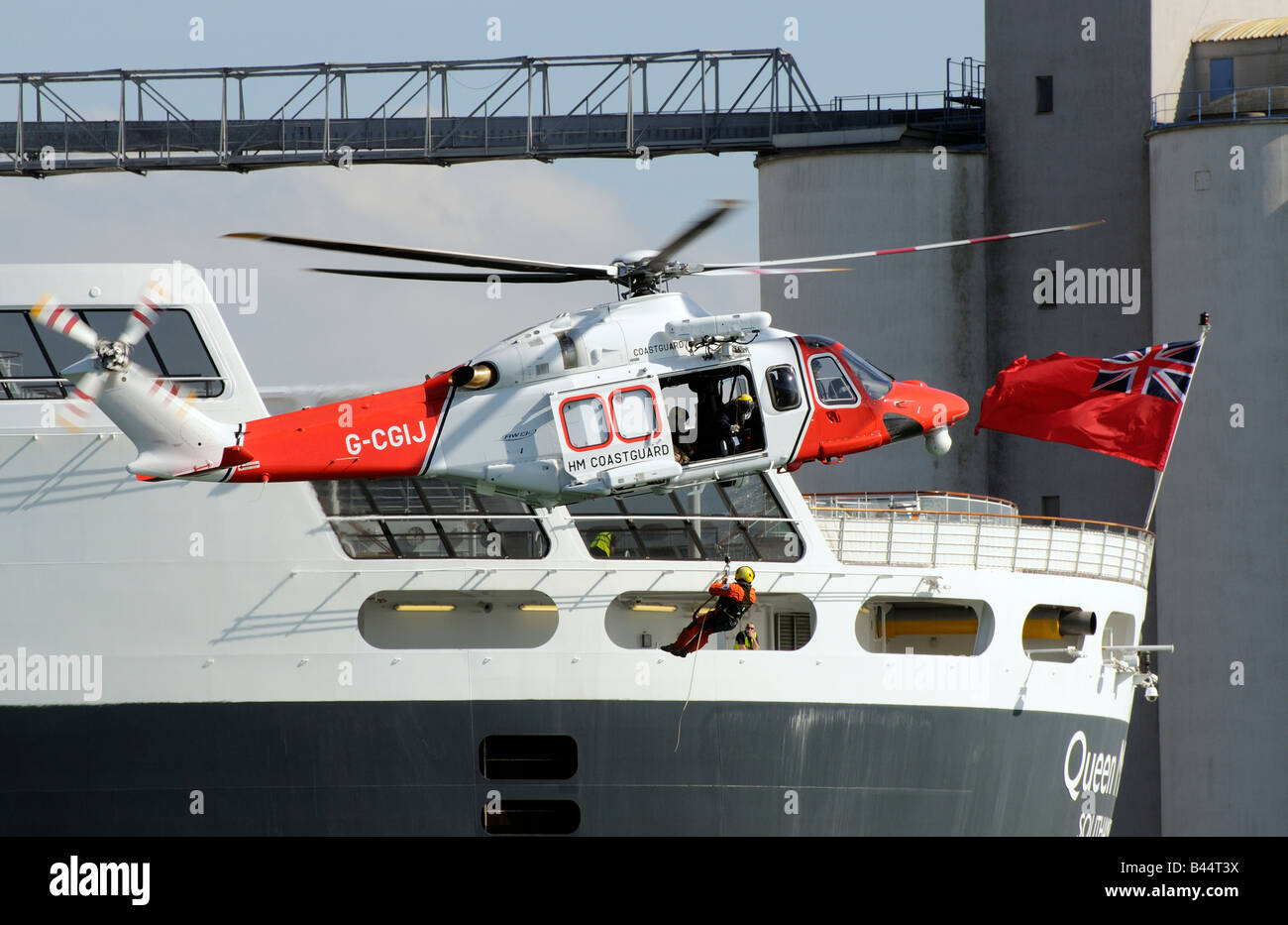 Coast Guard search and rescue helicopter on exercise with Queen Mary 2 ...