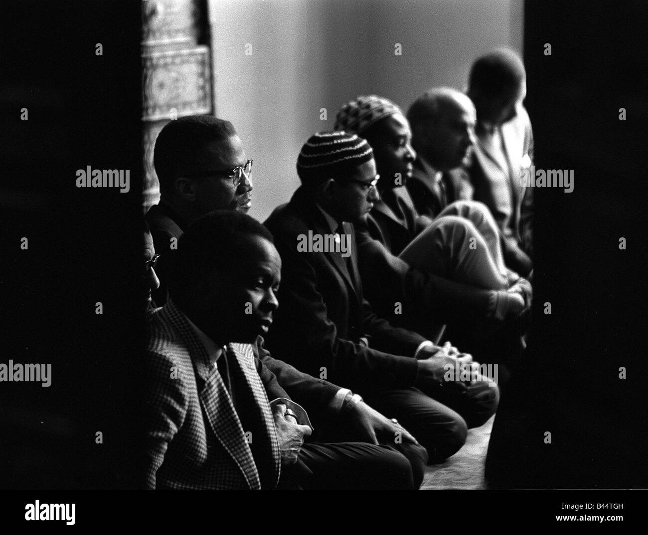 Malcolm X Jul 1964 praying in mosque Stock Photo - Alamy