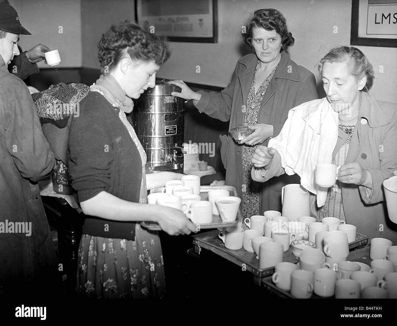 Women volunteers making refreshments for the rescue workers at the site ...