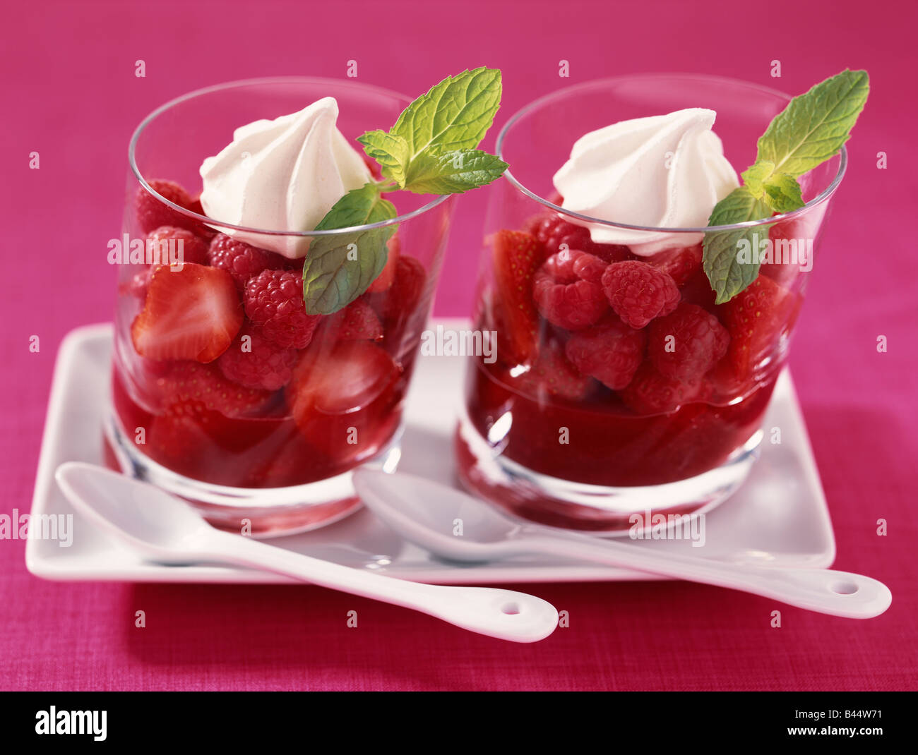 strawberry and raspberry consommé with meringues Stock Photo - Alamy