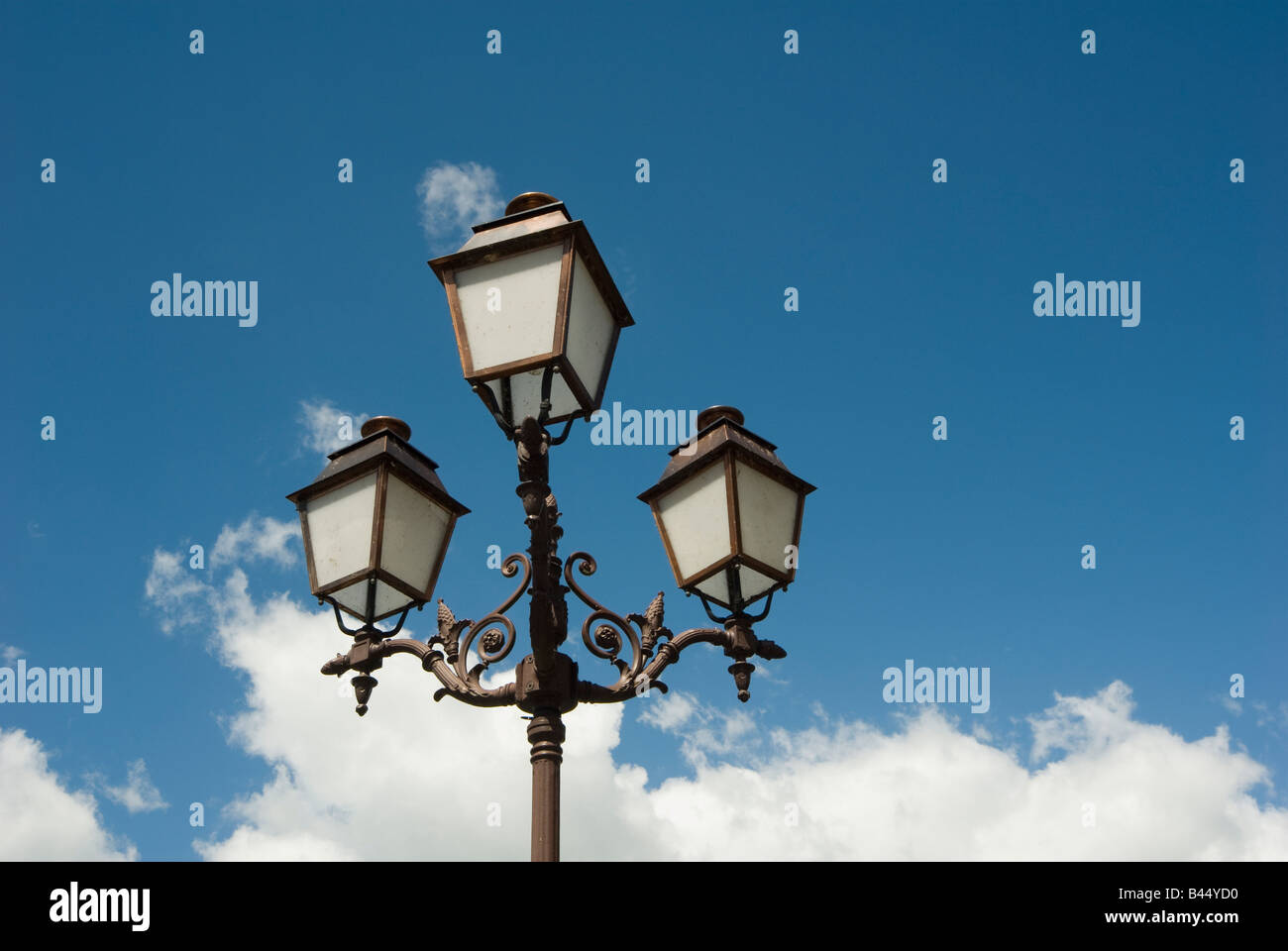 Typical french street lights against a bright blue sky in France Stock ...