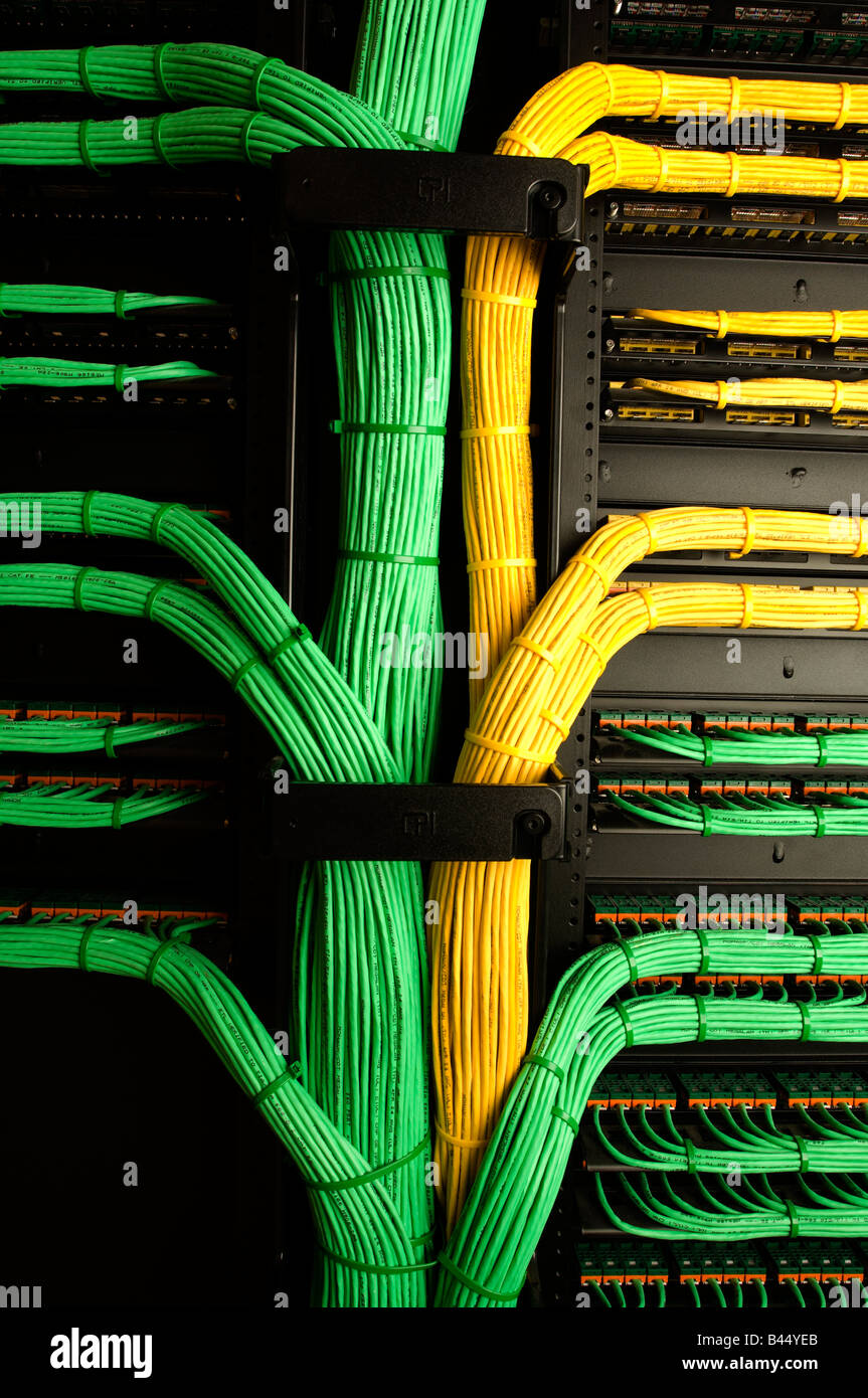 Bundles of yellow and green computer wires at data center computer ...