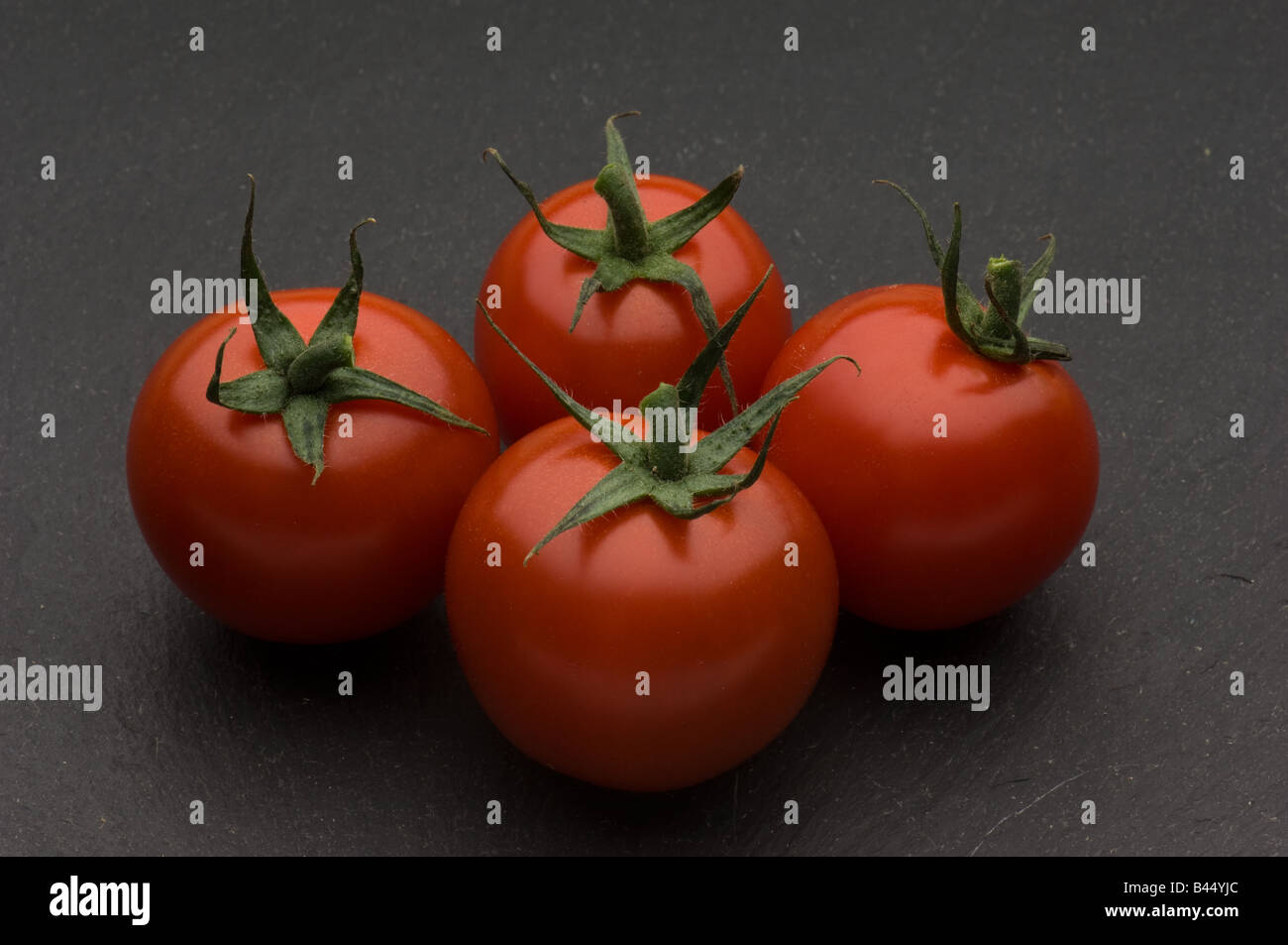 Four red tomatoes hi-res stock photography and images - Alamy