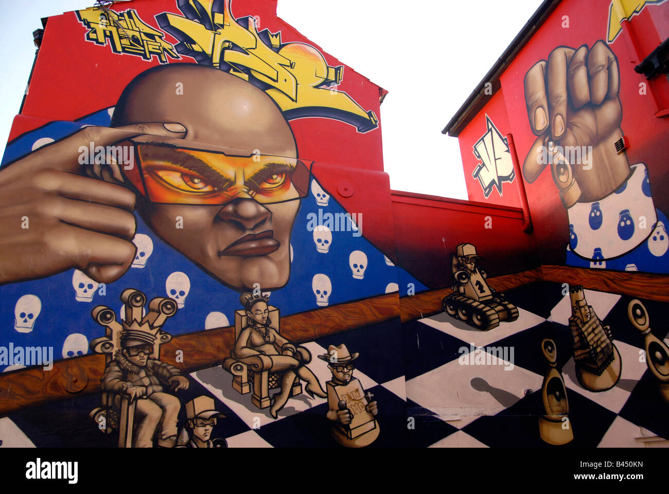 Urban graffiti with chess players painted on a house wall in Brighton ...