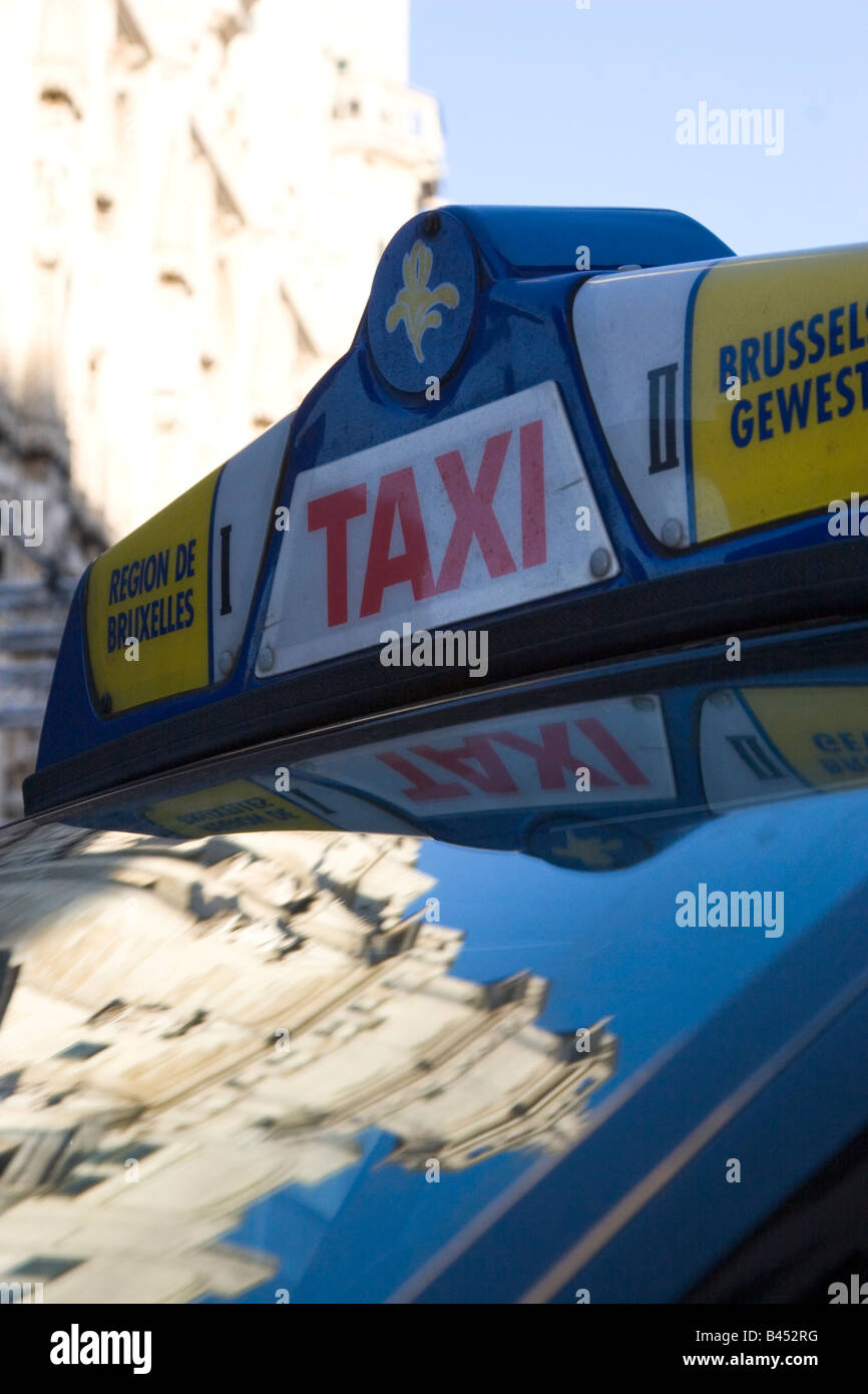 Roof top taxi sign of a cab in the city of Brussels, capital of Belgium ...