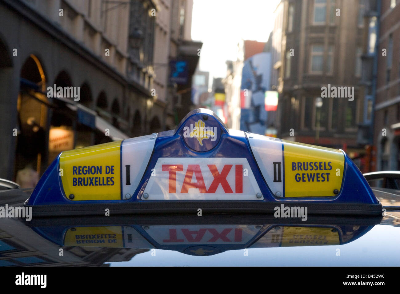 Roof top taxi sign of a cab in the city of Brussels, capital of Belgium ...