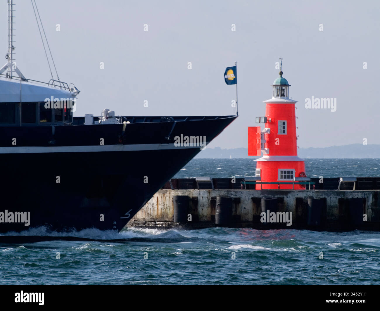 Ferry passing the beacon on the breakwater entrance to the Port of ...