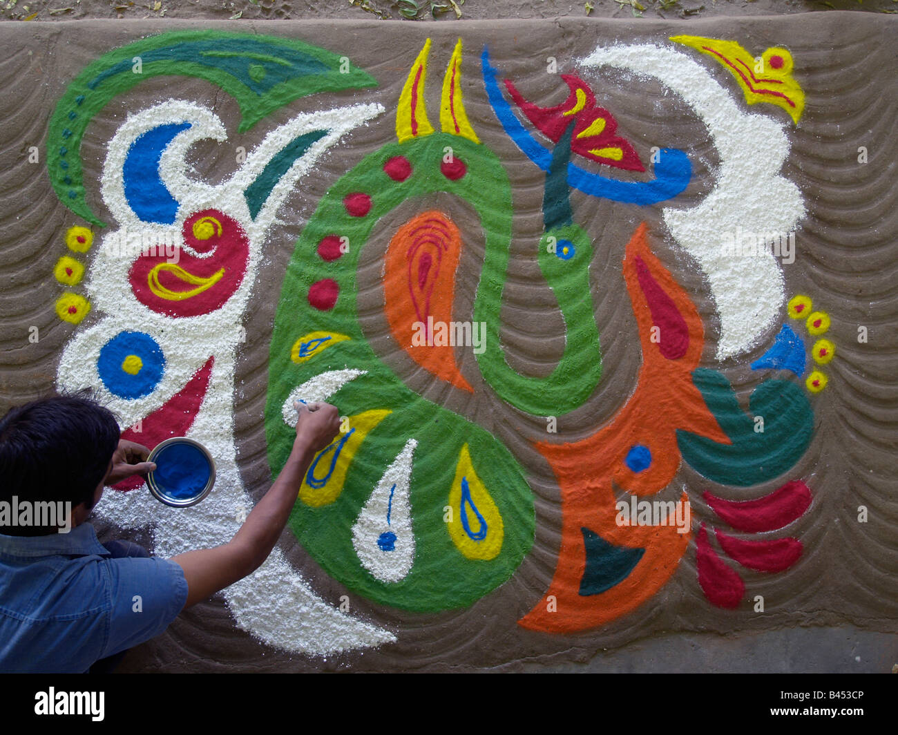 Creating a Rangoli (a design usually geometric drawn on the ground in ...