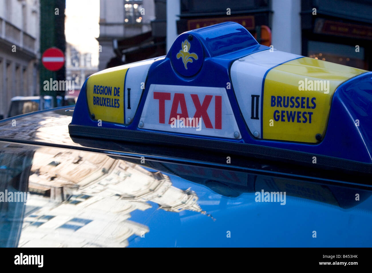 Roof top taxi sign of a cab in the city of Brussels, capital of Belgium ...