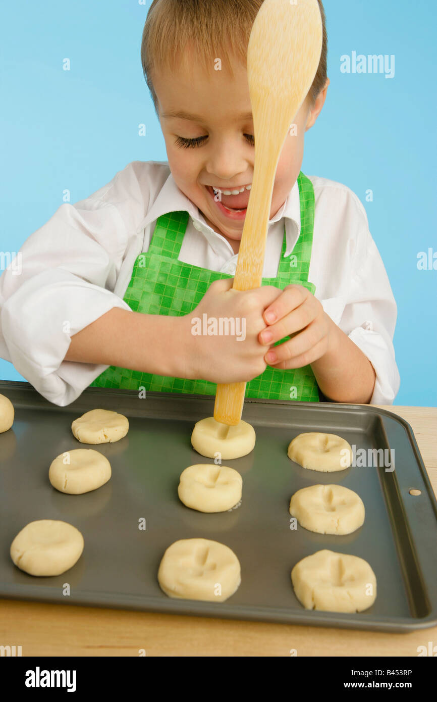 Boy making cookies Stock Photo - Alamy