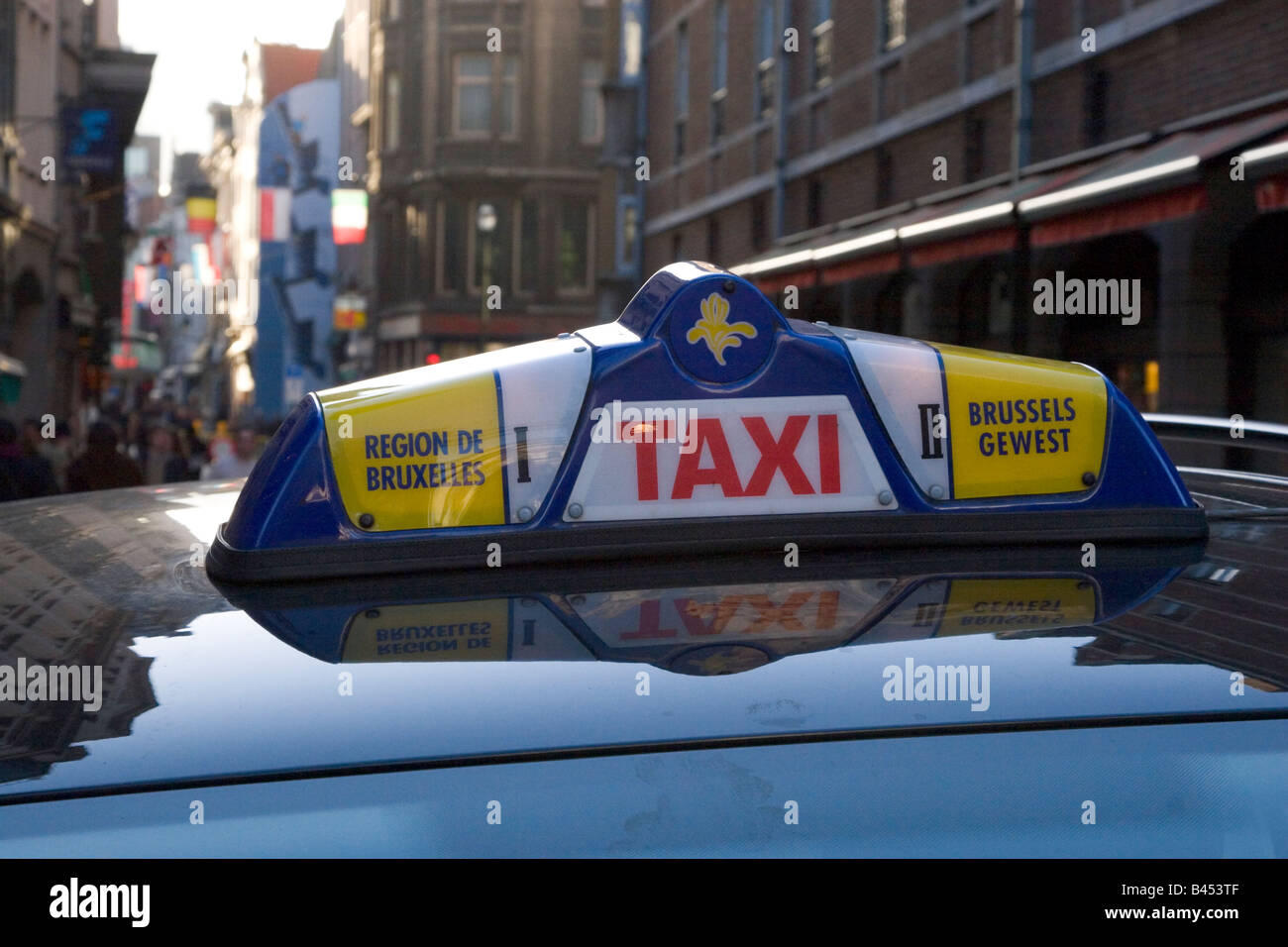 Roof top taxi sign of a cab in the city of Brussels, capital of Belgium ...