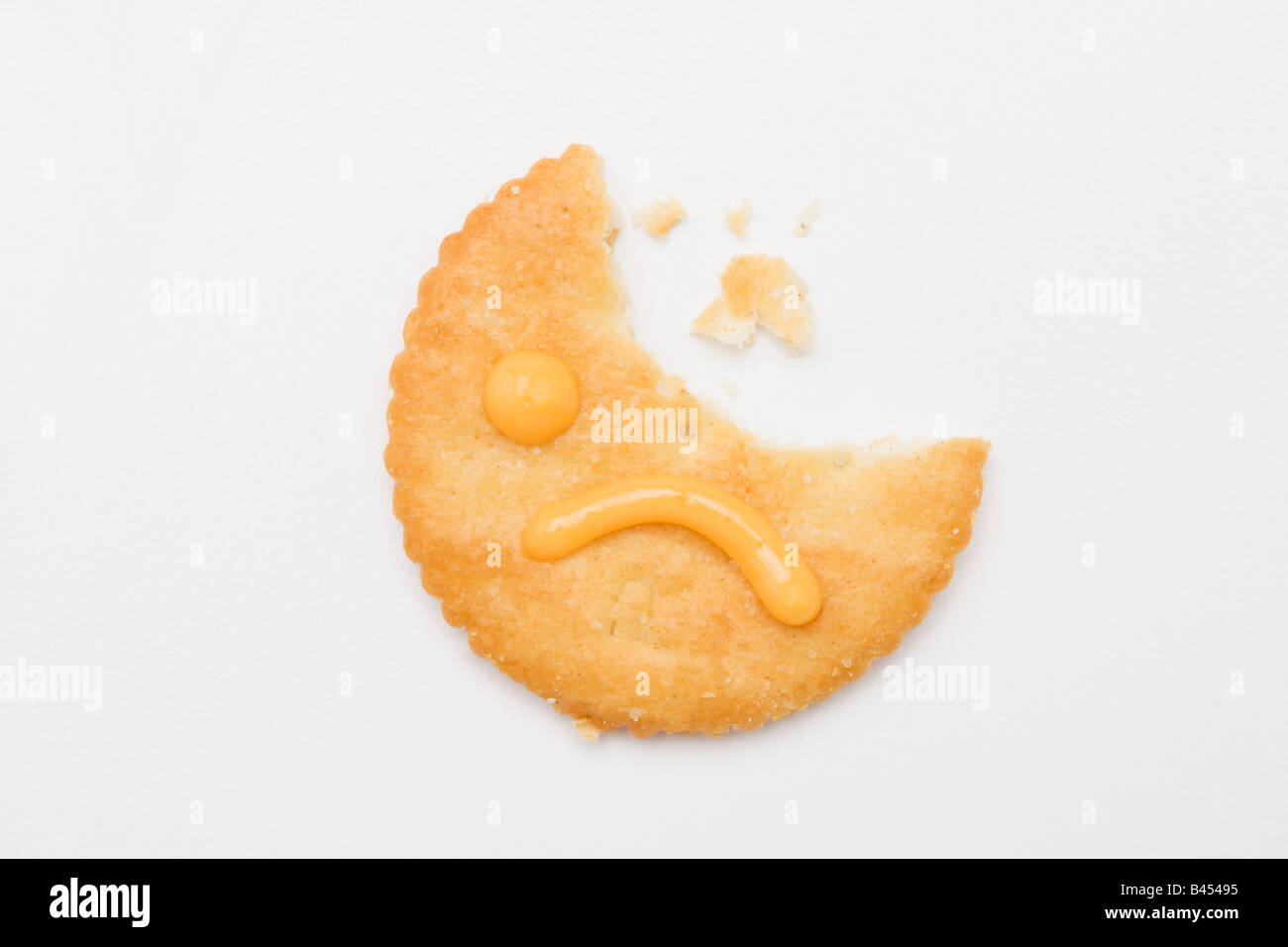 Sad face cracker Stock Photo - Alamy