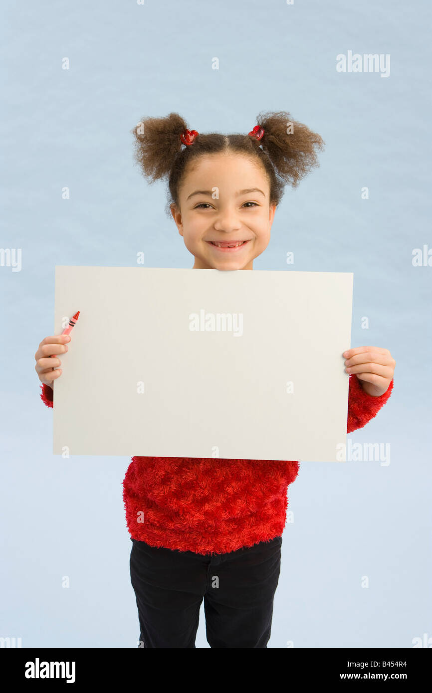 Girl holding up a book Stock Photo - Alamy