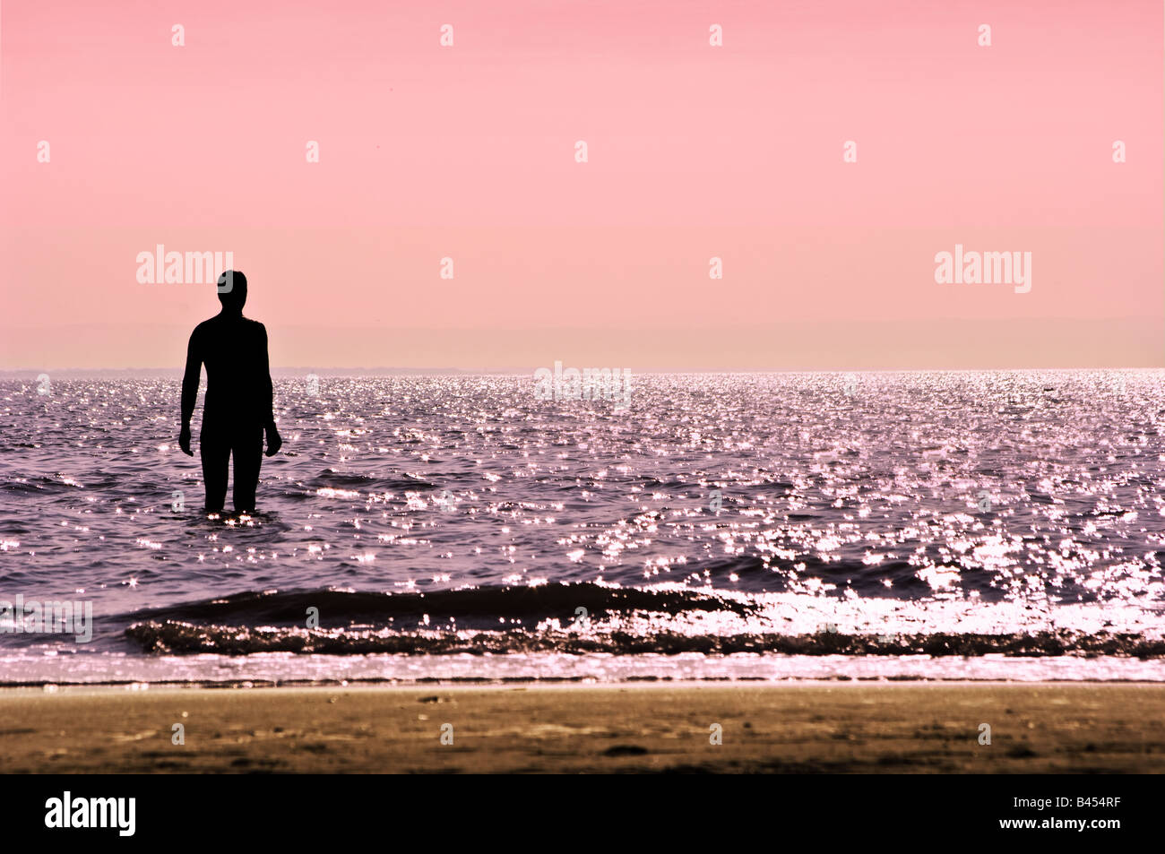 Iron man in the sea crosby beach Stock Photo - Alamy
