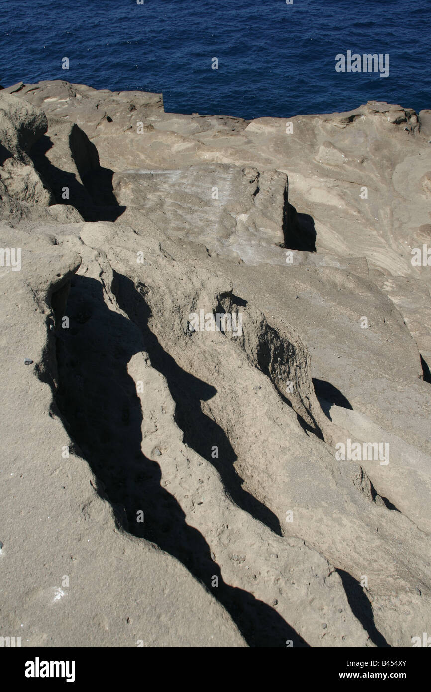 pattern on eroded volcanic rock formation on coast at venotene, italy ...