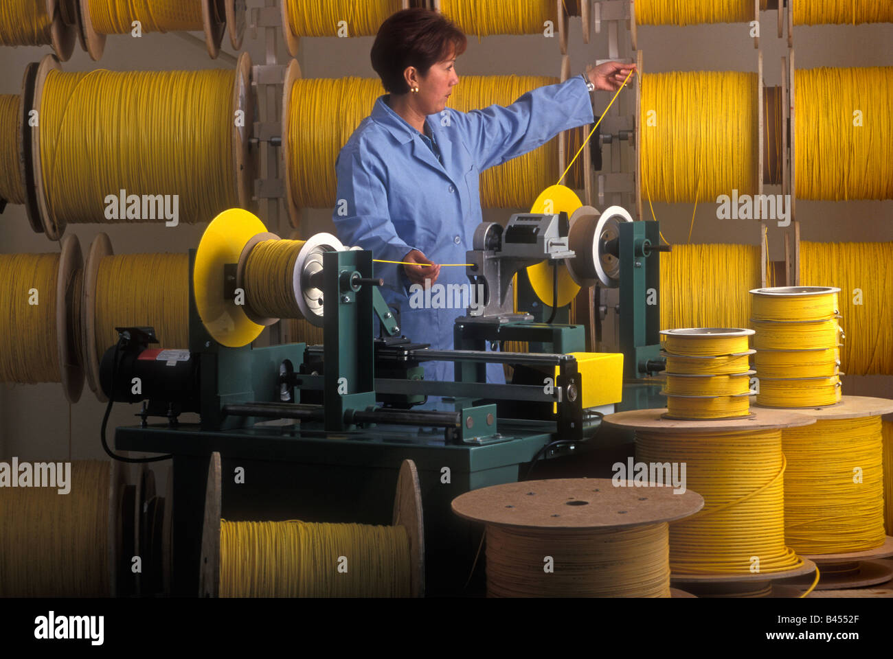 Worker with spools of fiber optics cable Stock Photo - Alamy