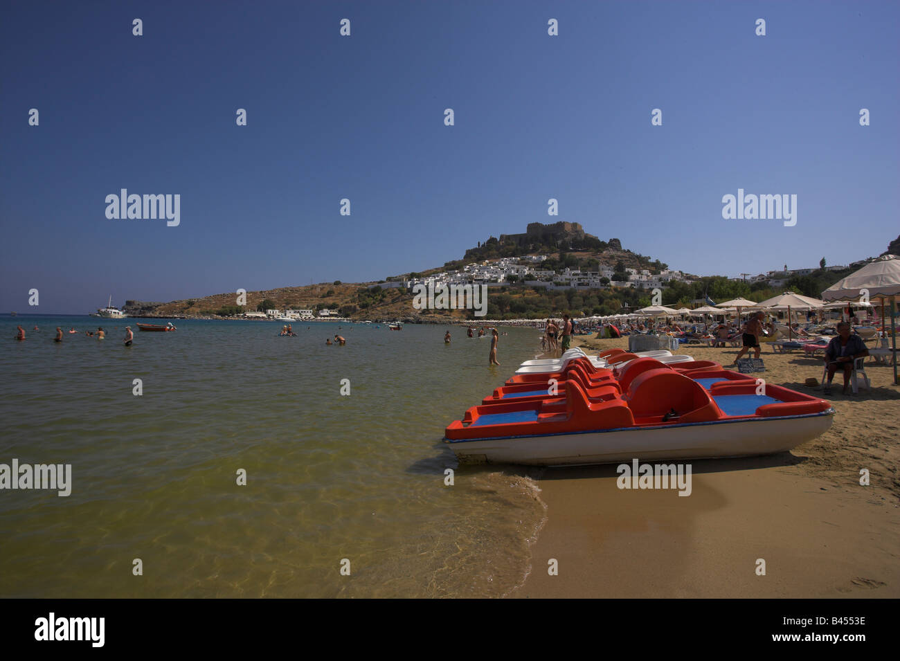 Above the modern town rises the acropolis of lindos hi-res stock ...