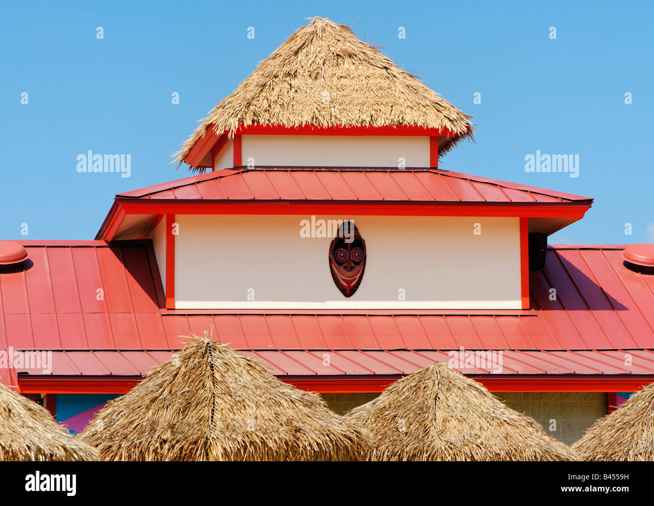 bamboo thatched roof at a tropical resort under a clear blue sky Stock ...