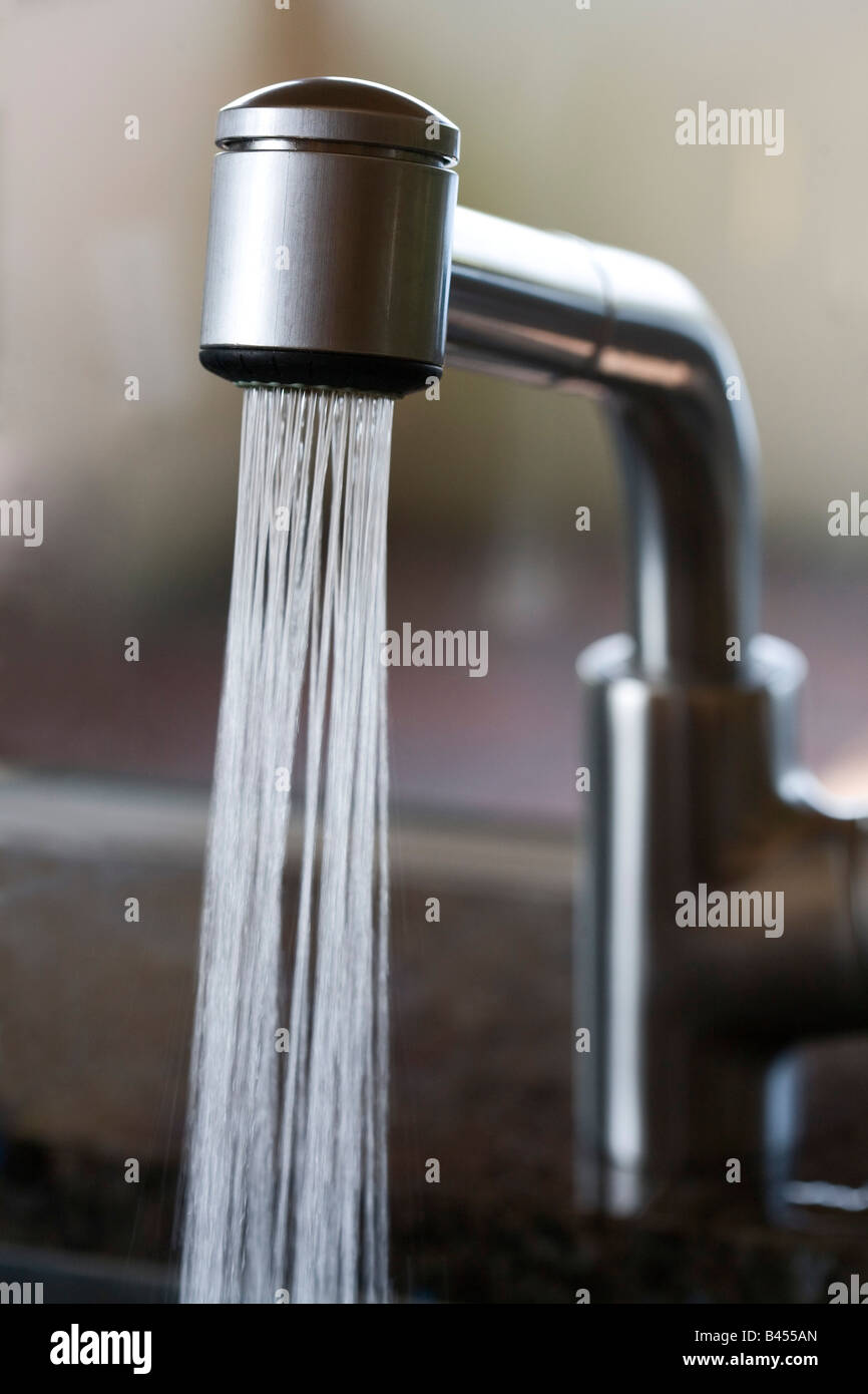 Water running from a sink faucet Stock Photo - Alamy