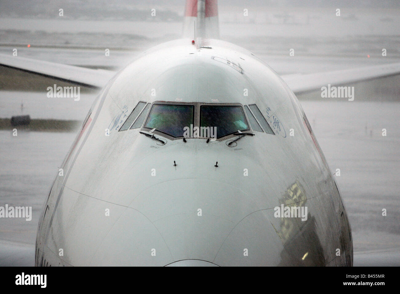 Boeing 747 at the gate in a rain storm, Logan International Airport ...