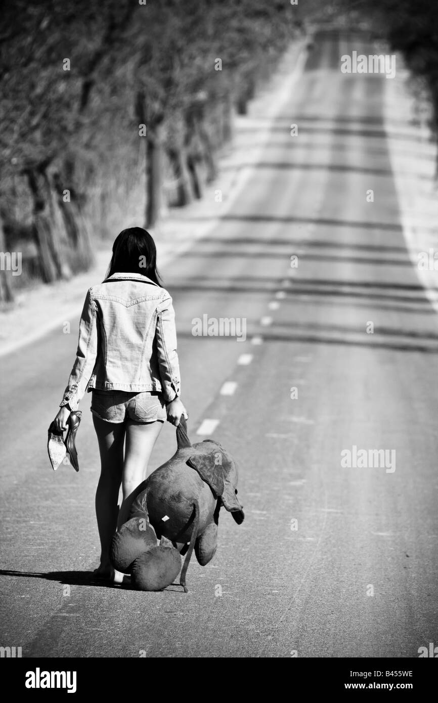 Young woman left behind with her teddy bear Stock Photo - Alamy