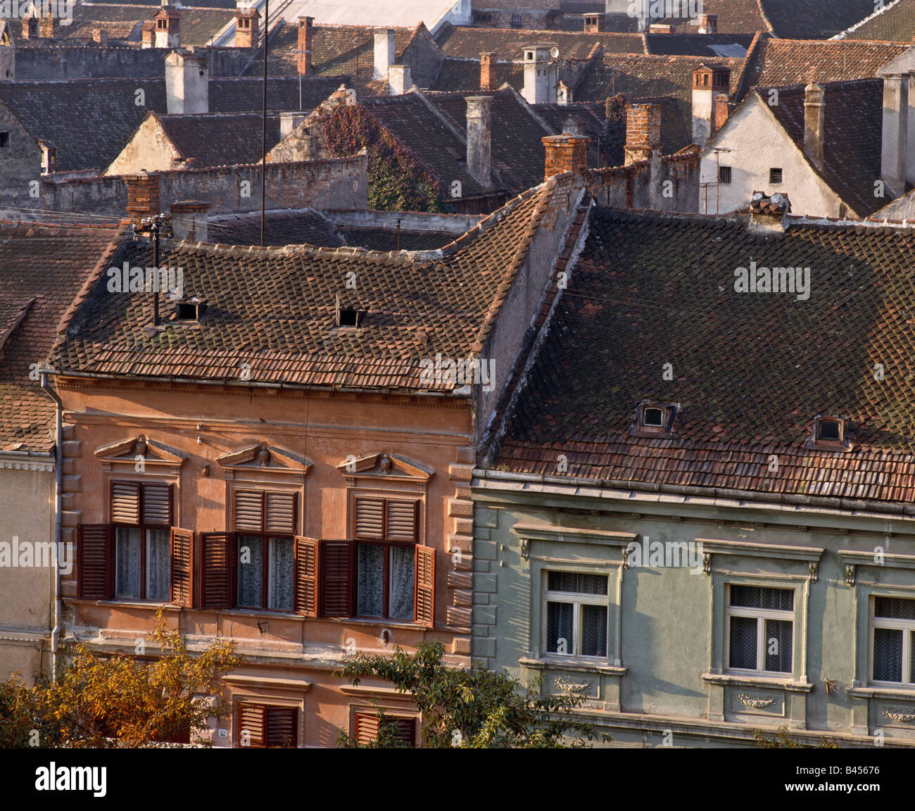 Early morning light on rooftops at Brasov in the Carpathian Mountains ...