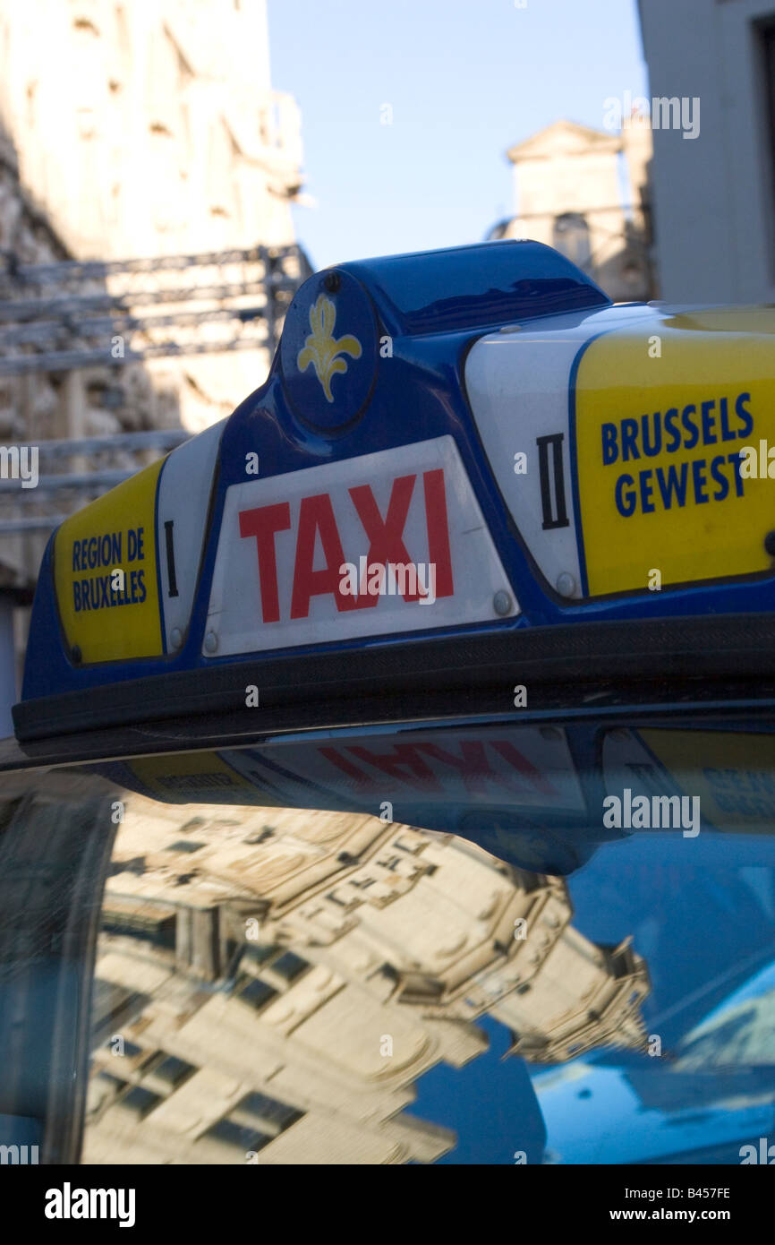 Roof top taxi sign of a cab in the city of Brussels, capital of Belgium ...