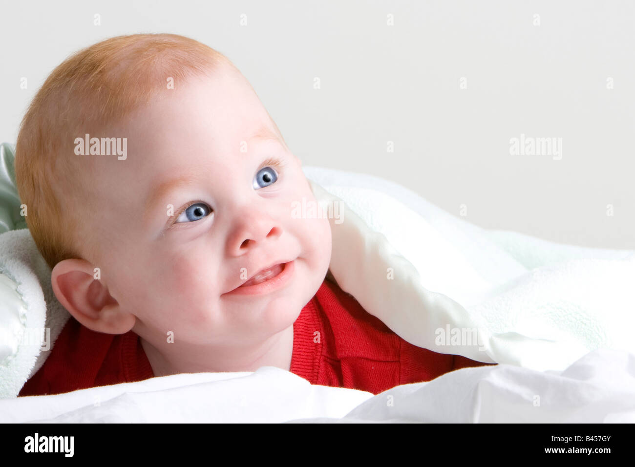 Beautiful redheaded baby boy on blanket Stock Photo - Alamy