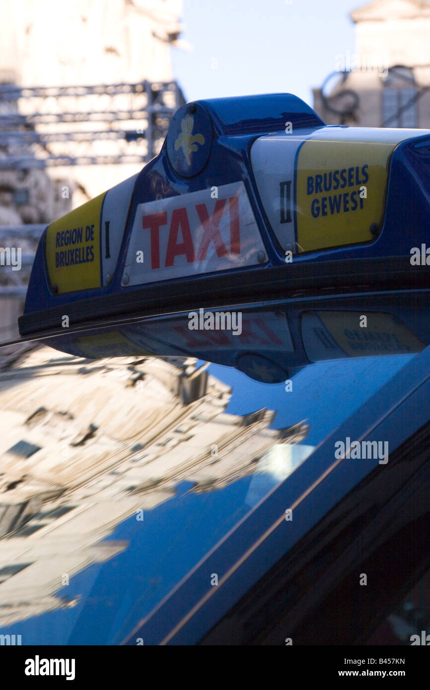 Roof top taxi sign of a cab in the city of Brussels, capital of Belgium ...