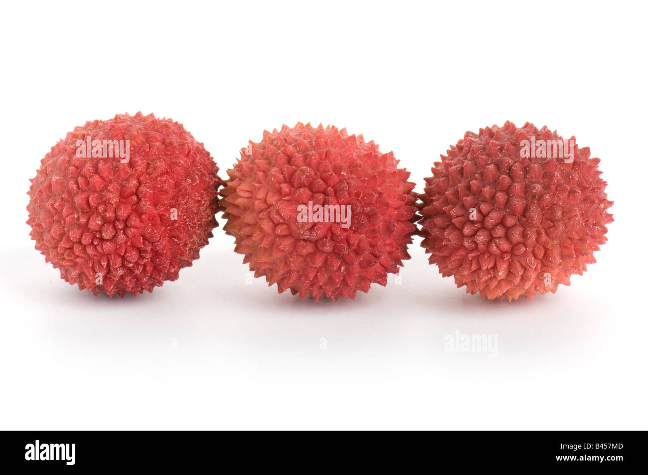 Three Lychee isolated on a white background Stock Photo - Alamy