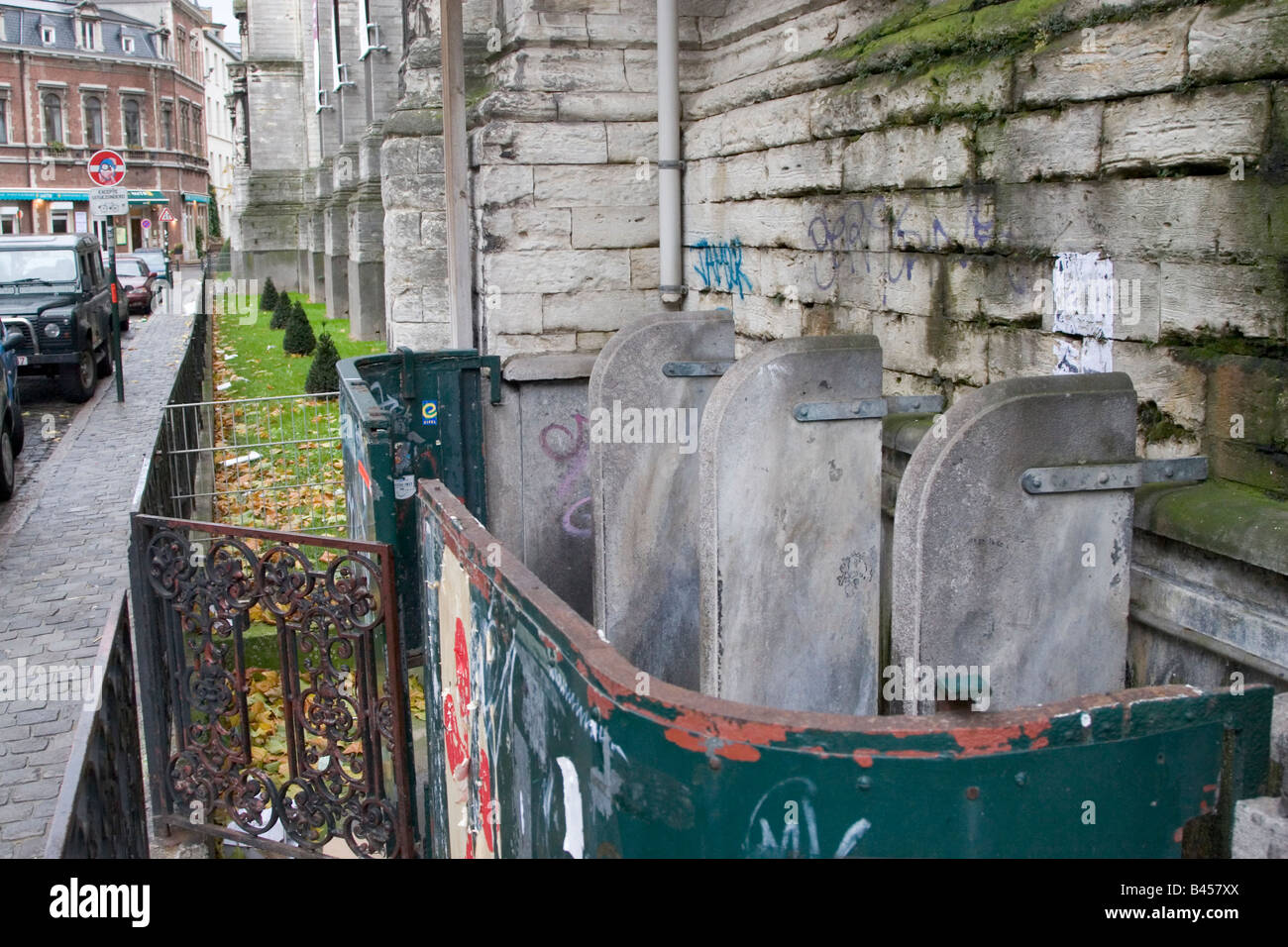 Bizarrely placed open air public urinals against the wall of an ...