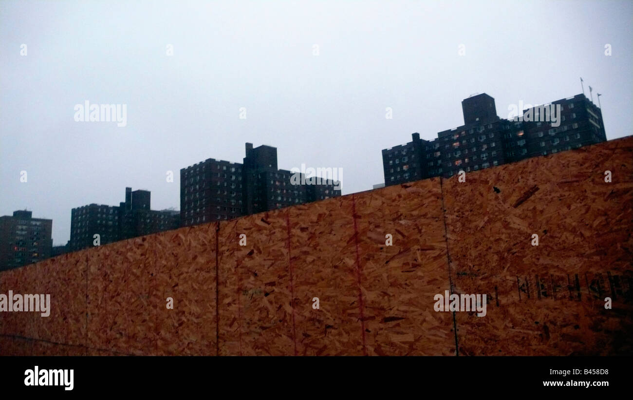 Fences mark a construction site with apartment buildings in the ...