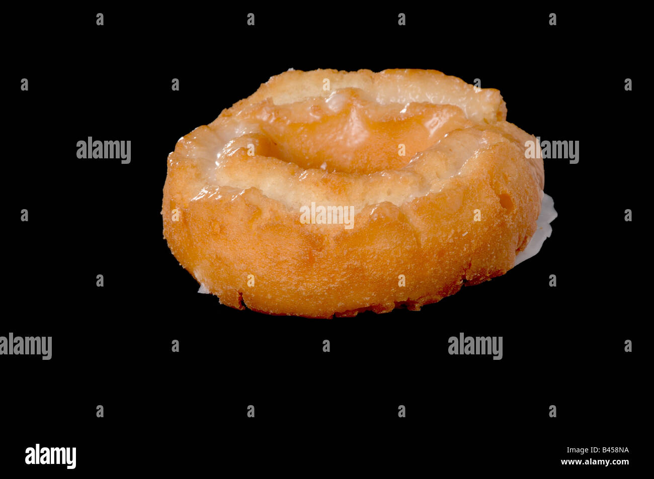 Old fashioned type donut isolated on black Stock Photo - Alamy