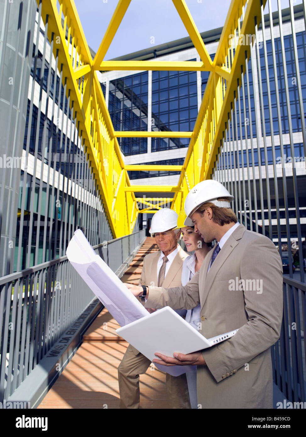 Engineer looking at bridge and plans hi-res stock photography and ...