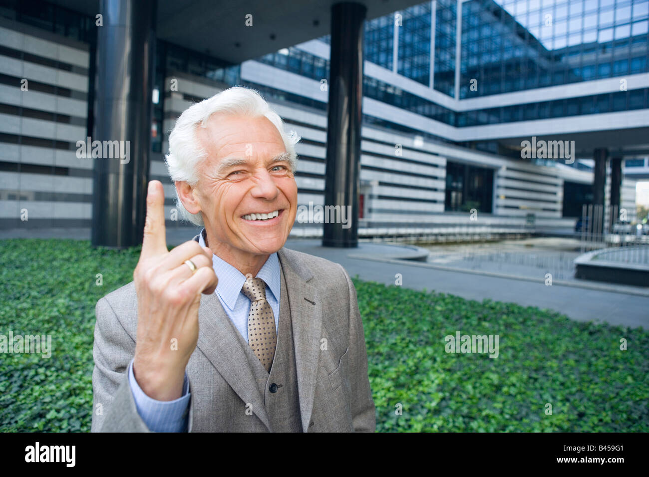Germany, Baden Württemberg, Stuttgart, Senior businessman gesturing ...