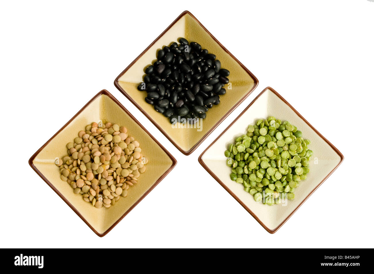 three plates with lentils, black beans, split peas Stock Photo - Alamy