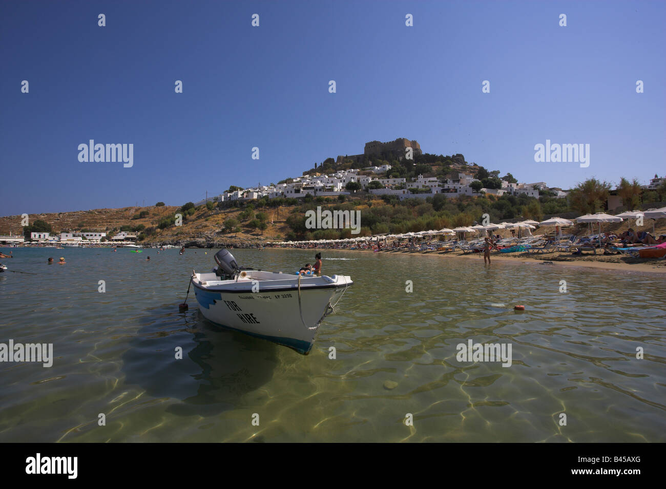 Above the modern town rises the acropolis of lindos hi-res stock ...