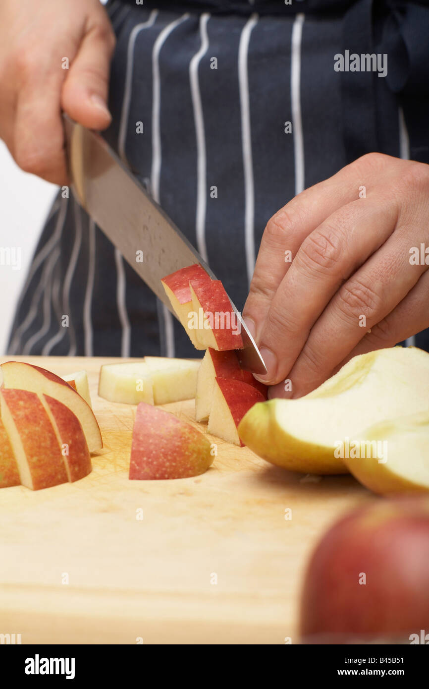 Person cutting apple pieces, close up Stock Photo - Alamy