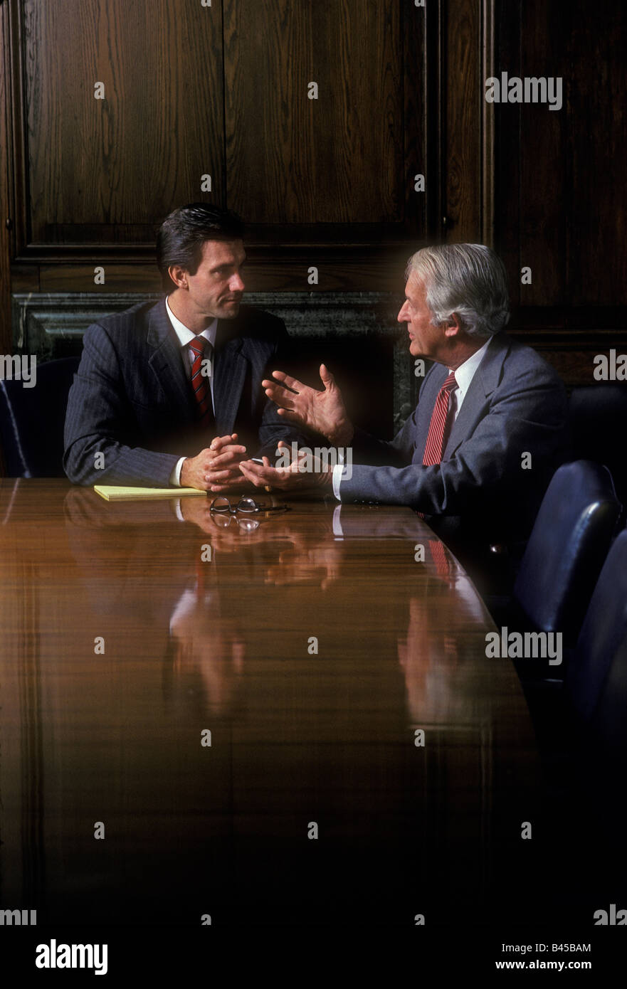 Two executives in board room meeting Stock Photo - Alamy