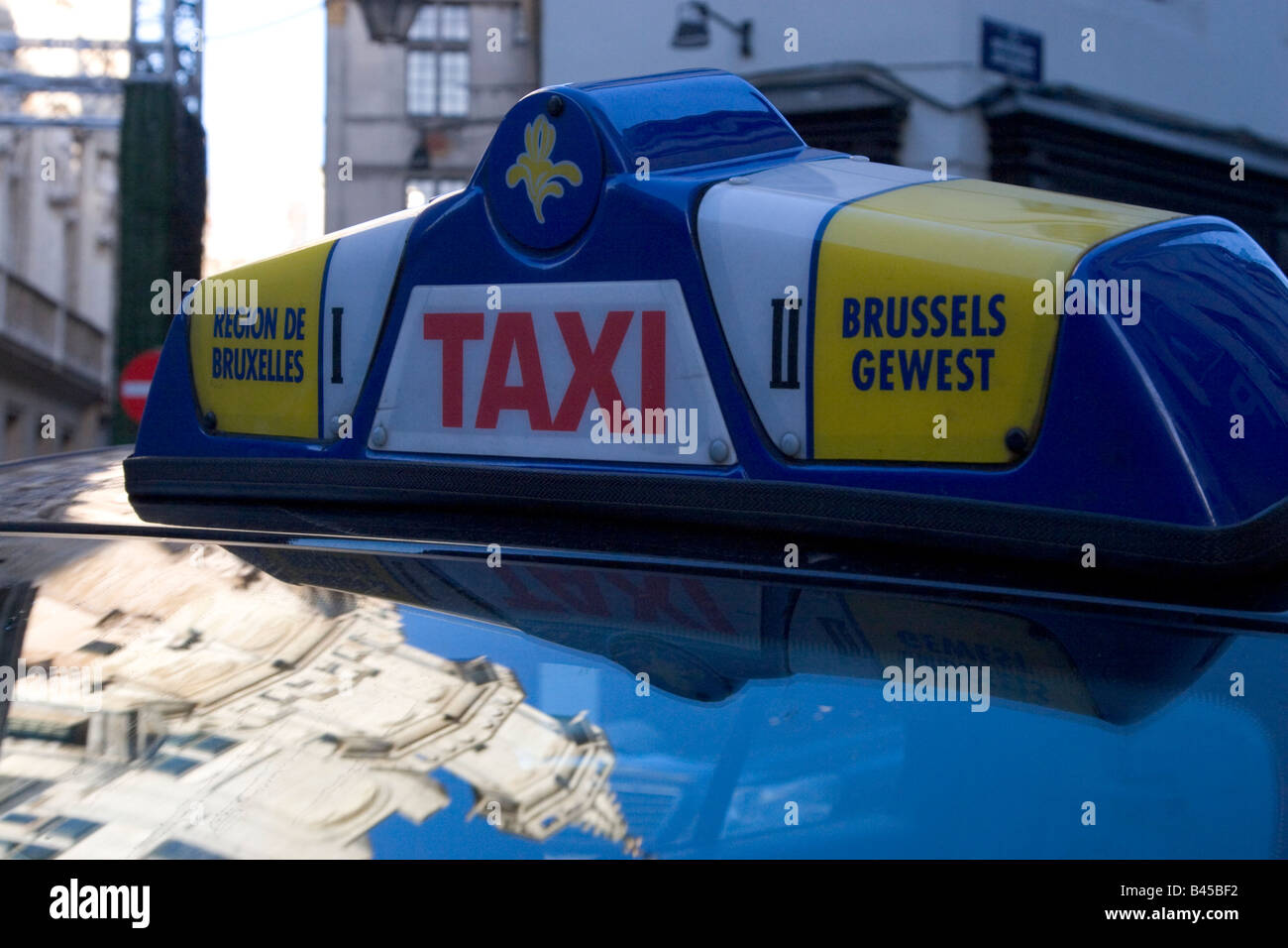 Roof top taxi sign of a cab in the city of Brussels, capital of Belgium ...